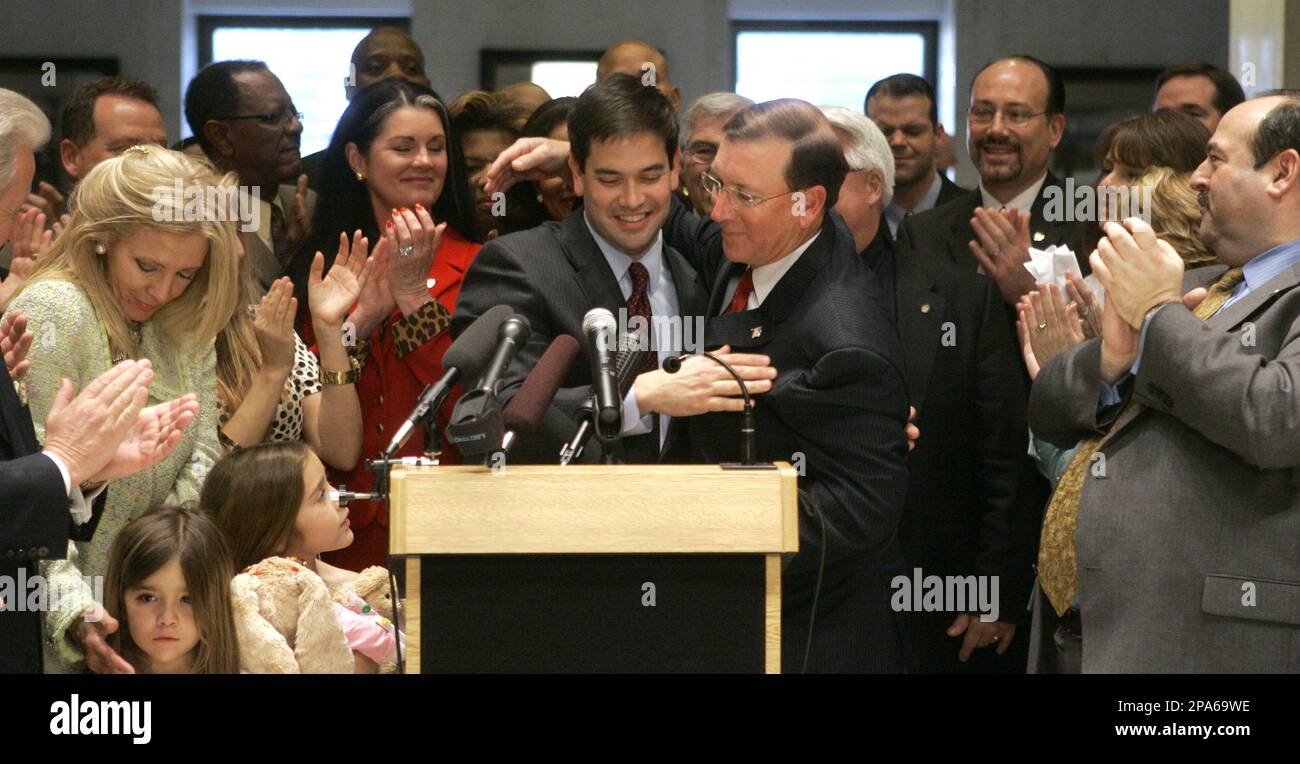 Members of the Florida Legislature applaud House Speaker Marco Rubio, R ...