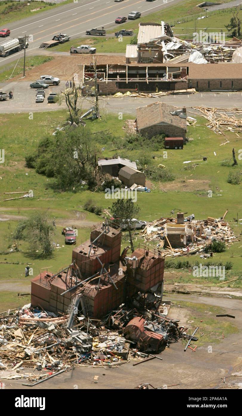 A feed store, bottom, and a church, top, lie in ruins in Damascus, Ark ...