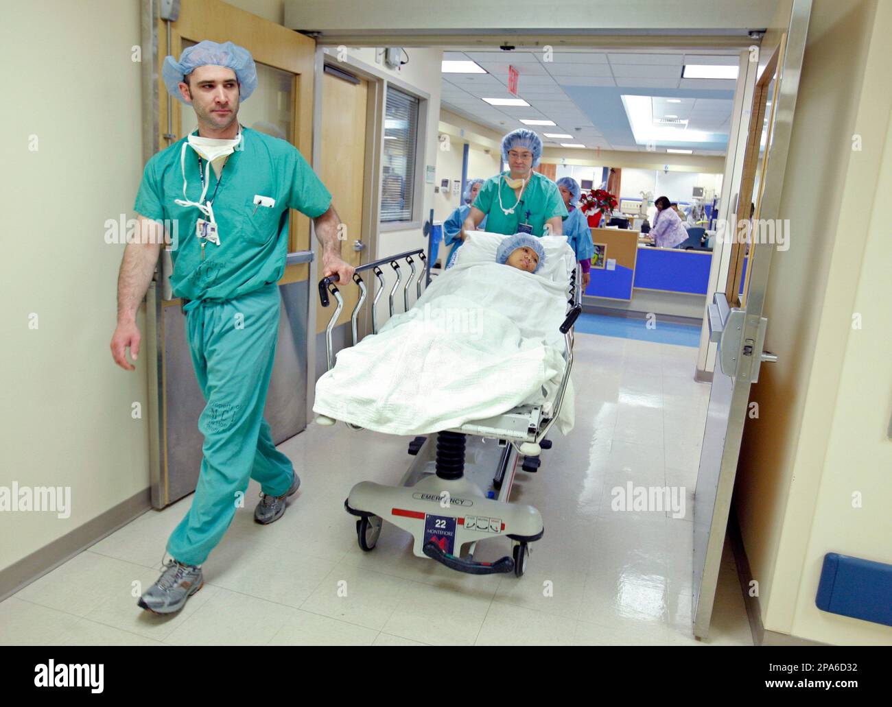 Jingle Luis, 15, from the Philippines, is wheeled to surgery by Dr ...