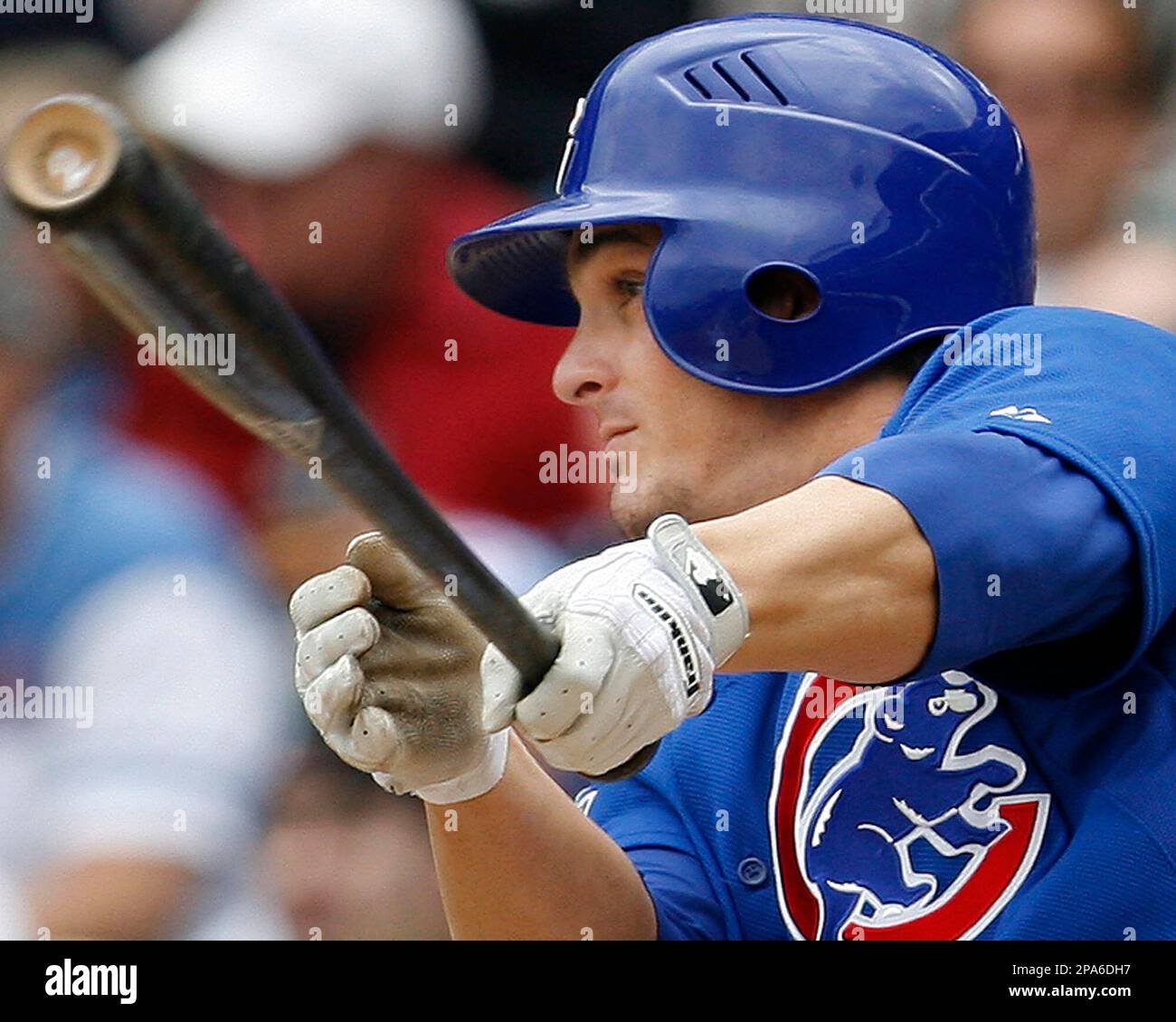 Chicago Cubs' Ryan Theriot hits a single against the Milwaukee Brewers ...