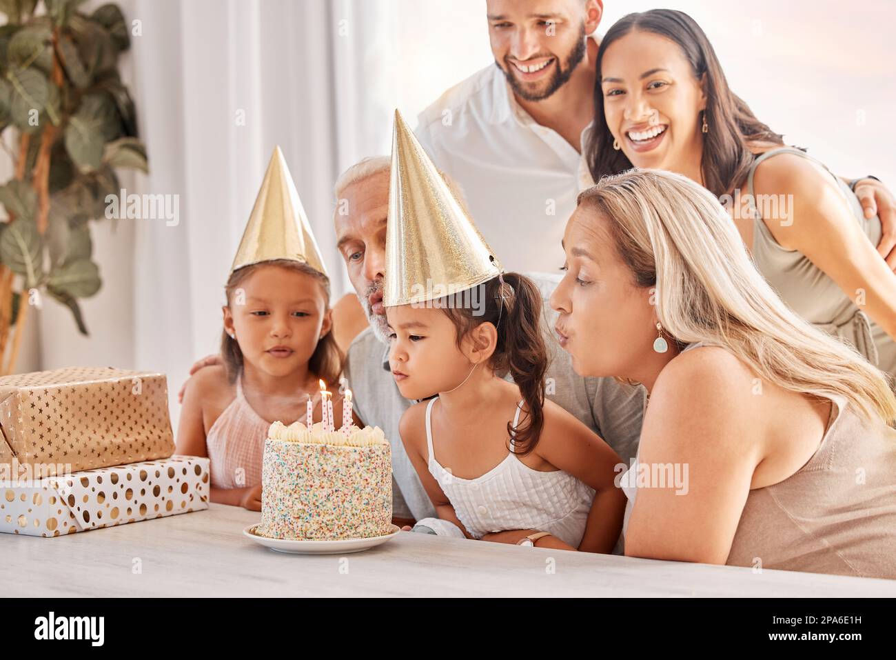 Family, kids and birthday cake with a child and her big family ...