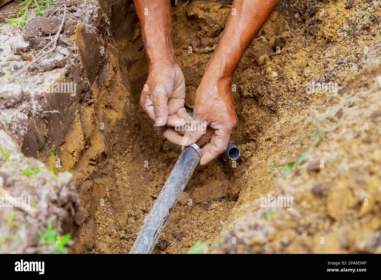 During installation of underground sprinkler system to water garden an ...