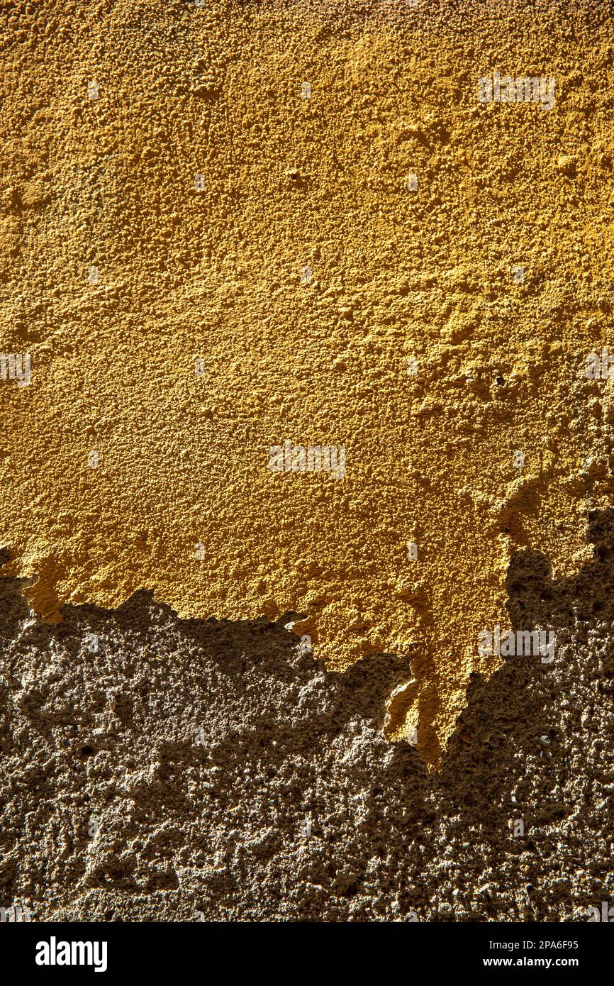 Bright ochre antique plaster with eye-catching partial damage Stock ...