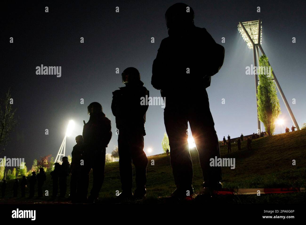 German riot police stand guard at the Mauerpark during May Day event in ...