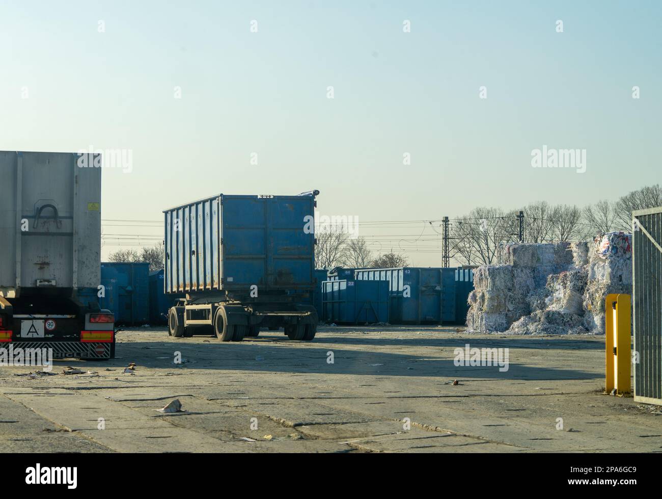 Heavy trailer parked in the recycling yard along plastic waste bales ...