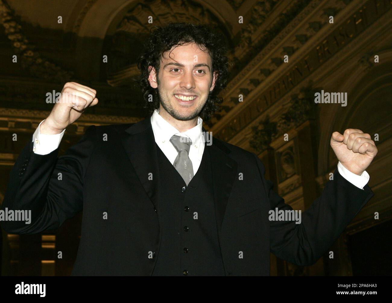 Italian actor Andrea Iaia jokes with photographers during the first ...