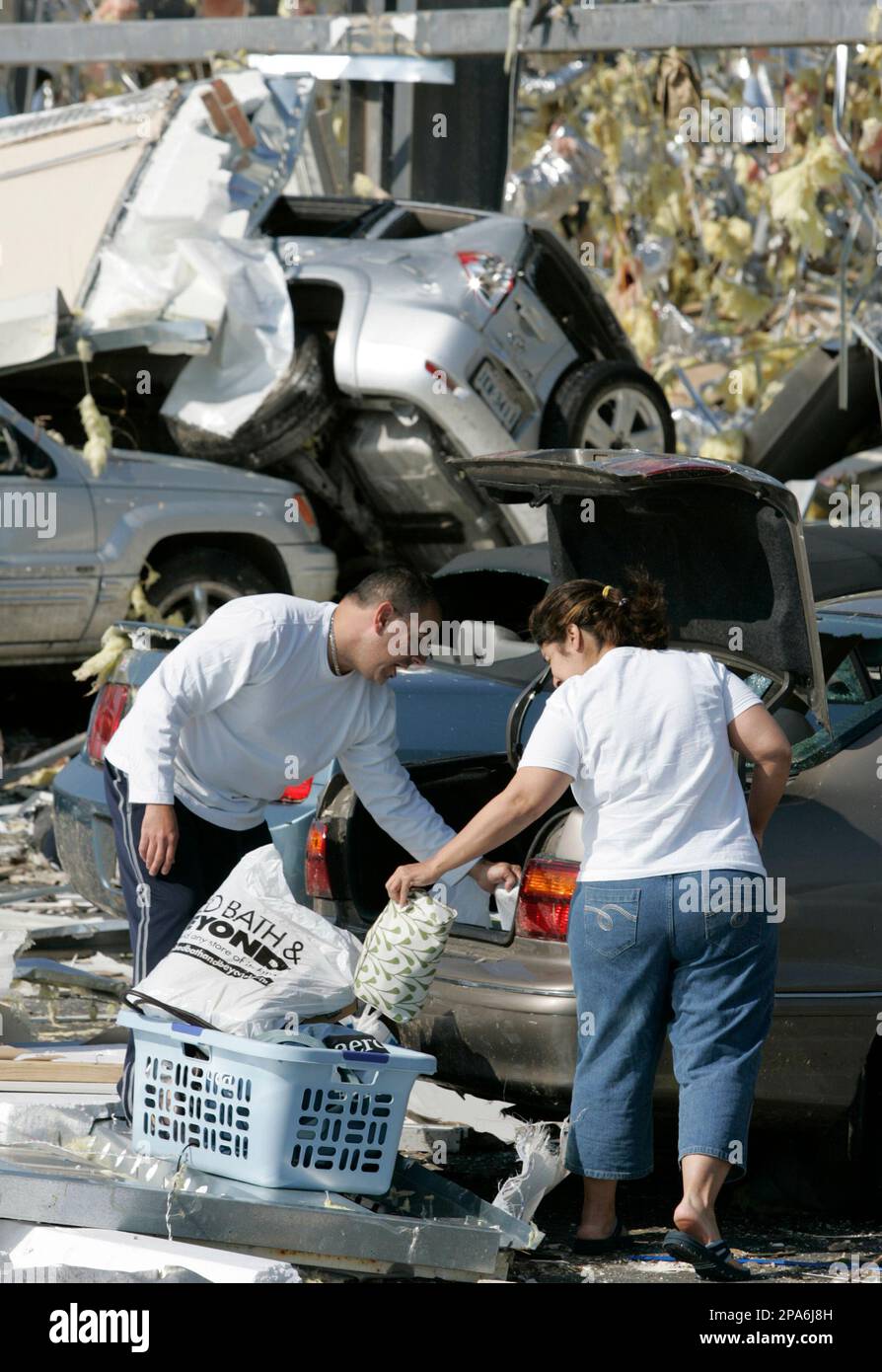 Lou Ramos and his wife Sarah, remove belongings from their tornado ...