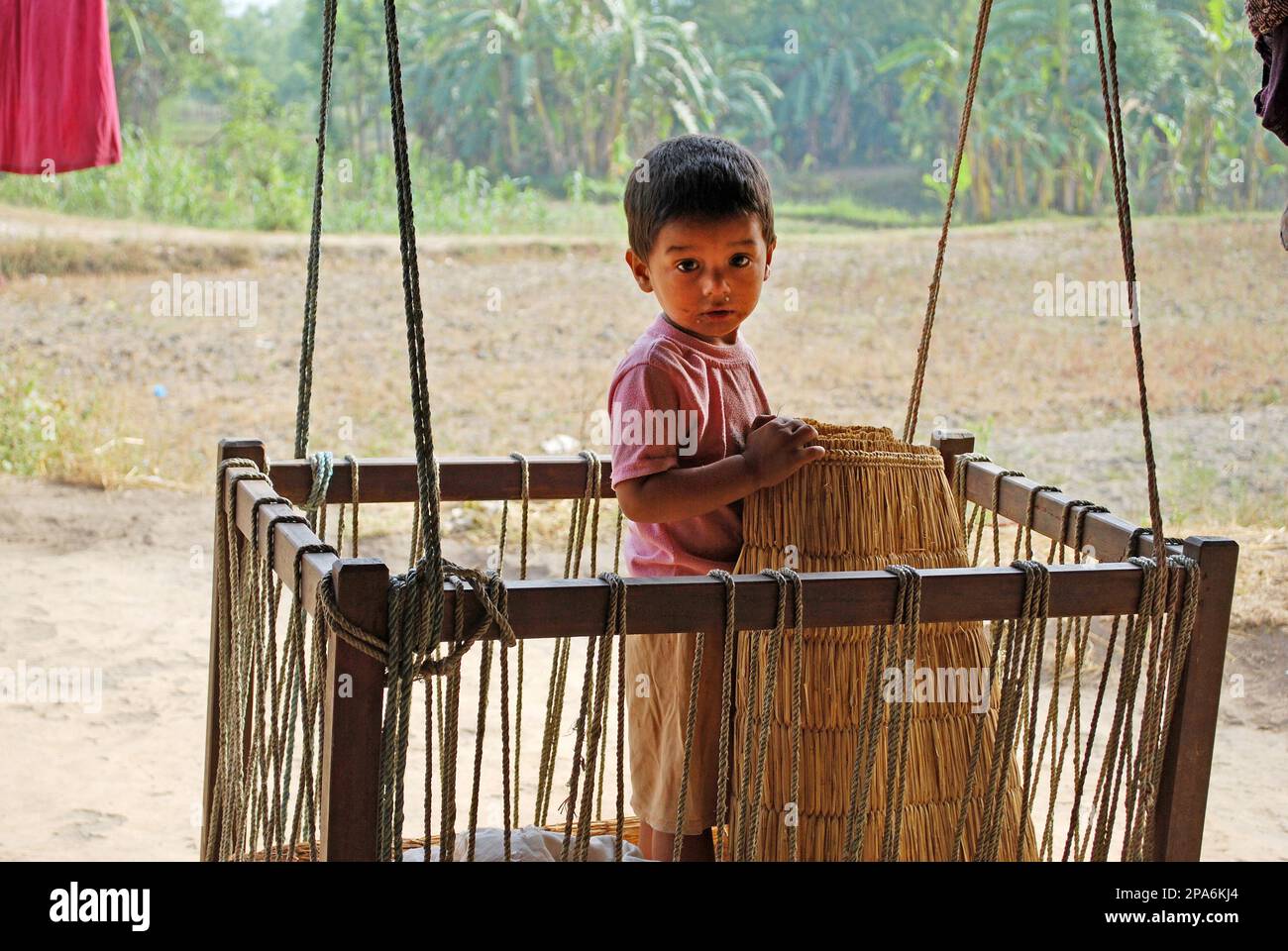 Baby in the hanging cradle, rural life - Nepal Stock Photo - Alamy