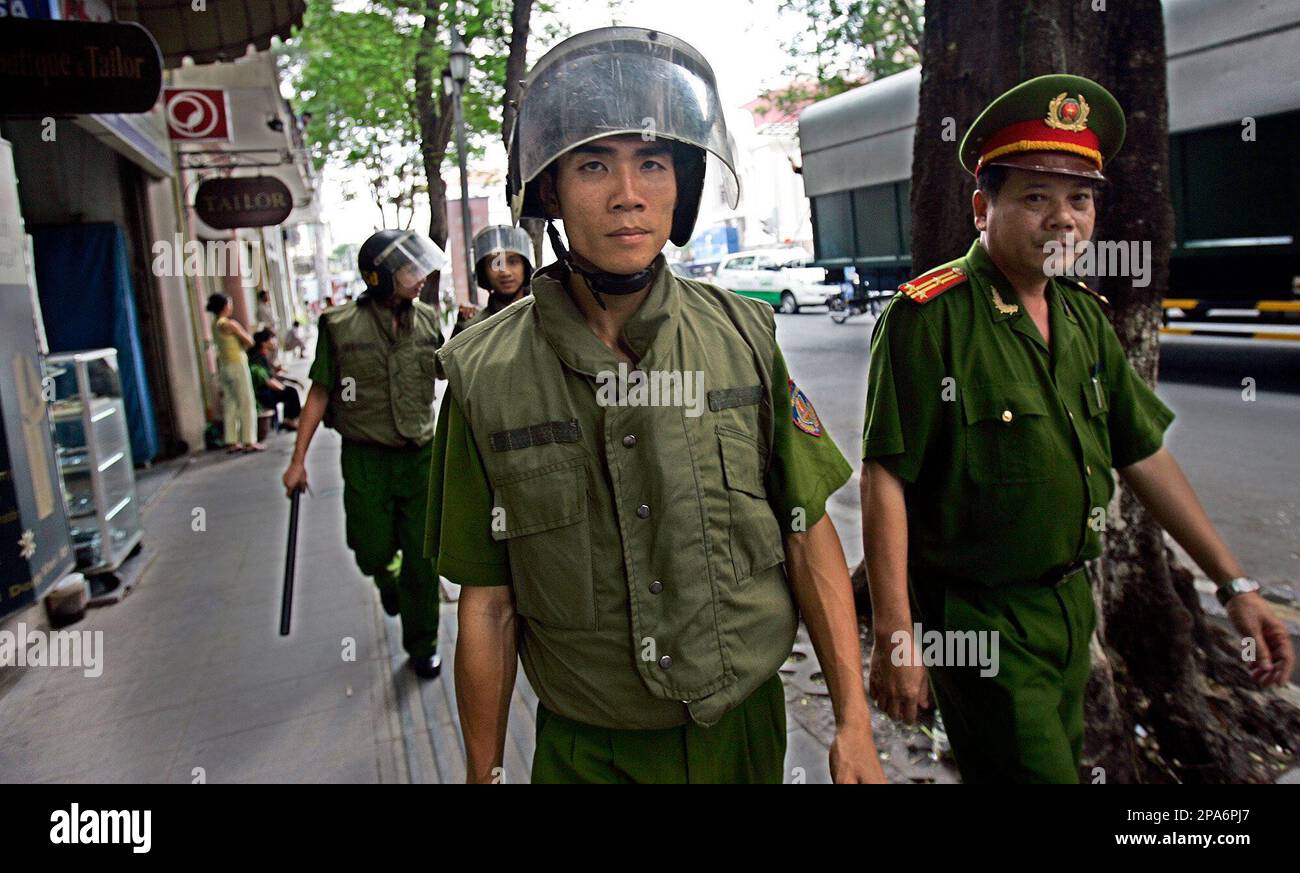 Vietnamese police officers patrol around the Opera House in Ho Chi Minh ...