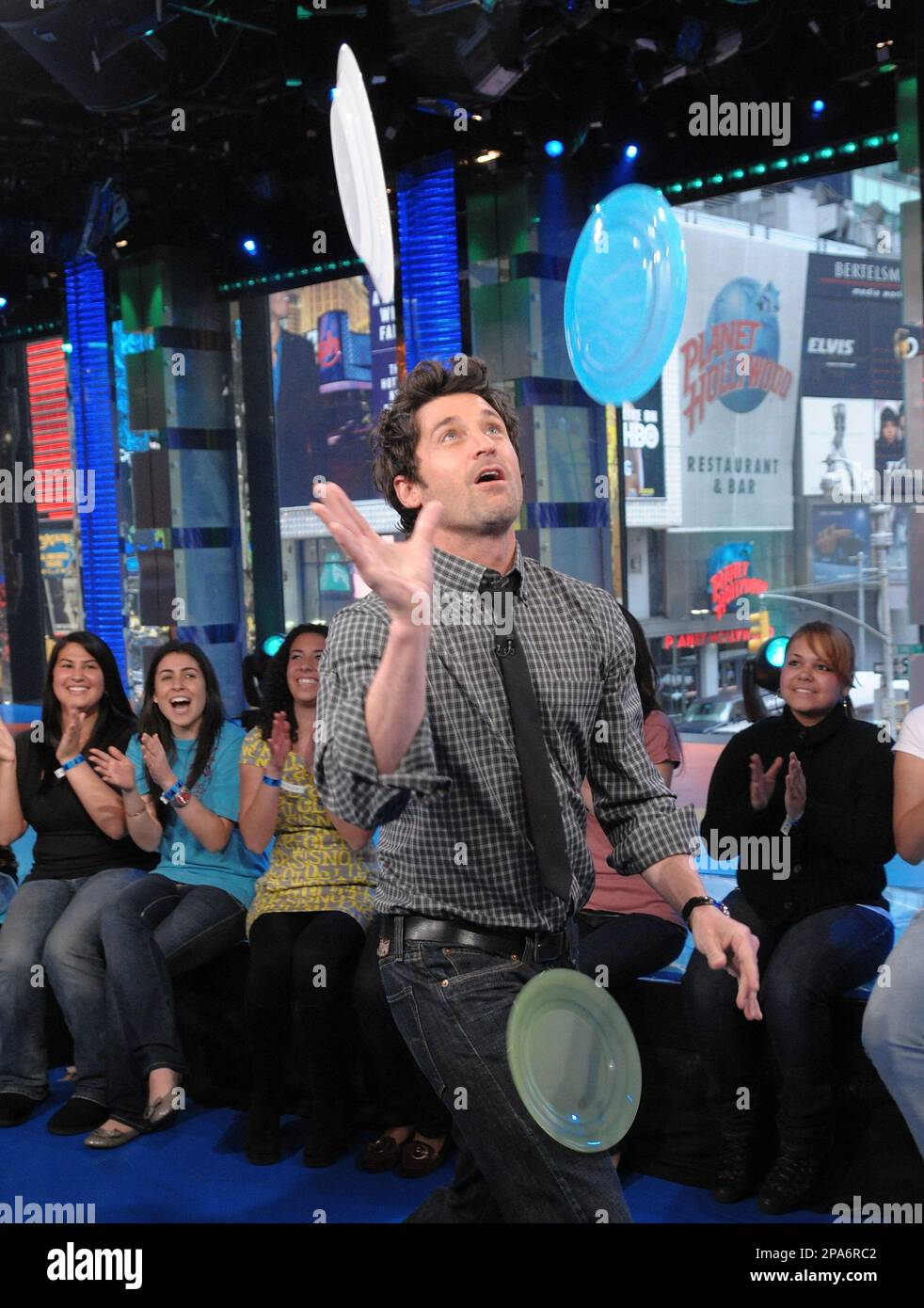Actor Patrick Dempsey shows off his juggling skills during an ...