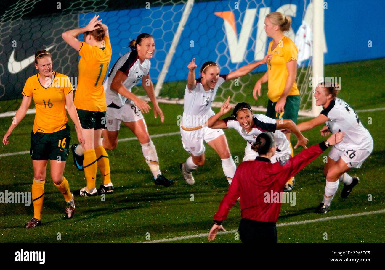 United States' Carli Lloyd, behind referee, reacts with teammates ...