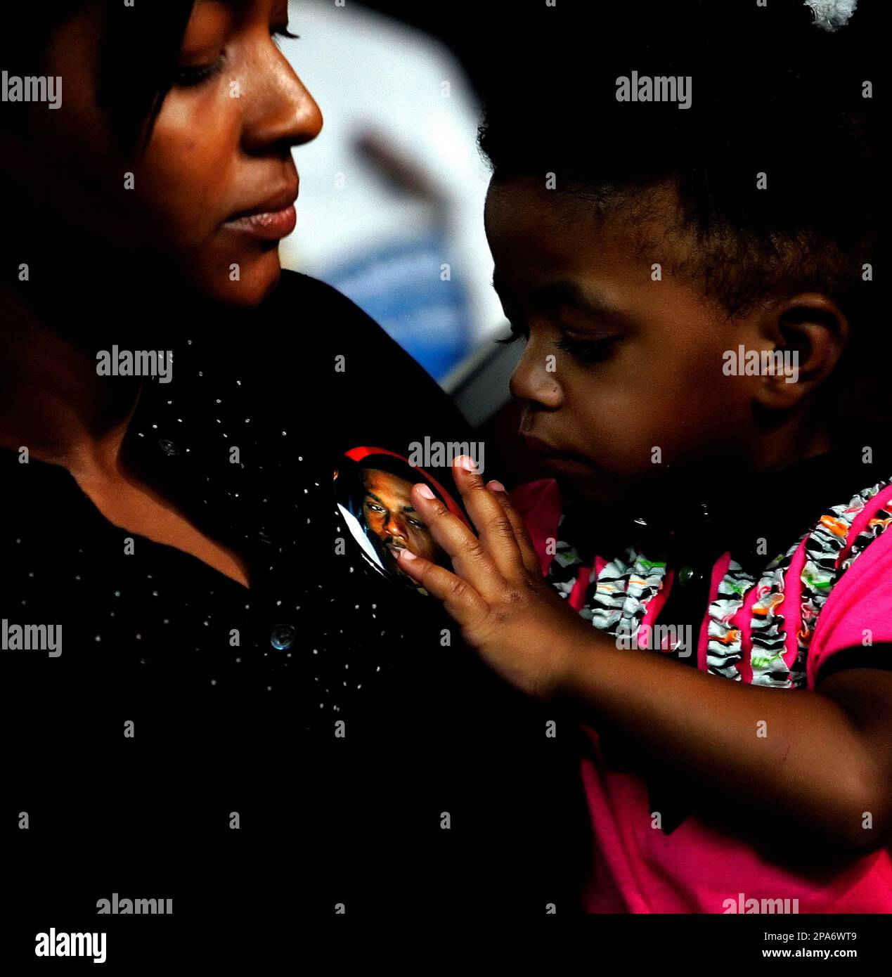 Sean's Bell's fiancee, Nicole Paultre Bell holds her daughter Jordyn as ...