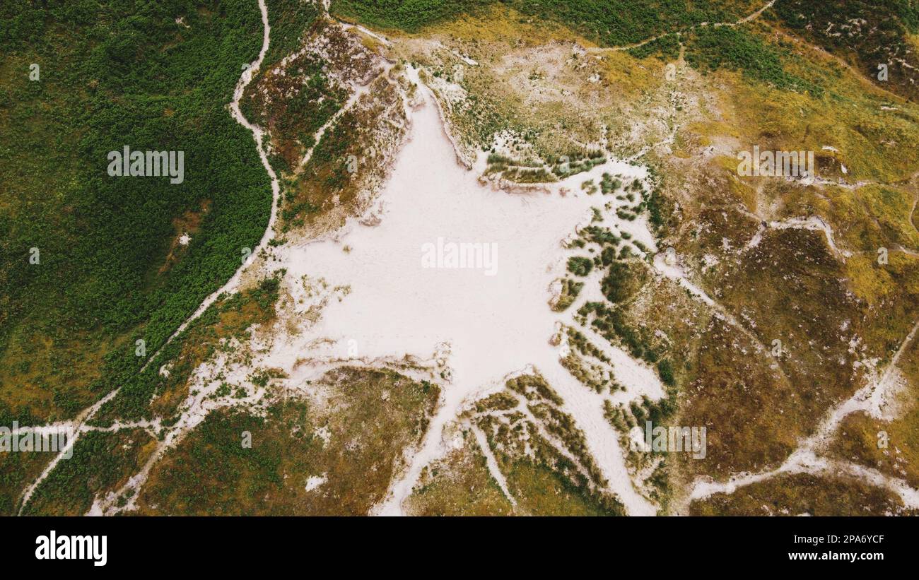 Picturesque hills, plants grow on sand dunes. Hilly terrain, top view ...