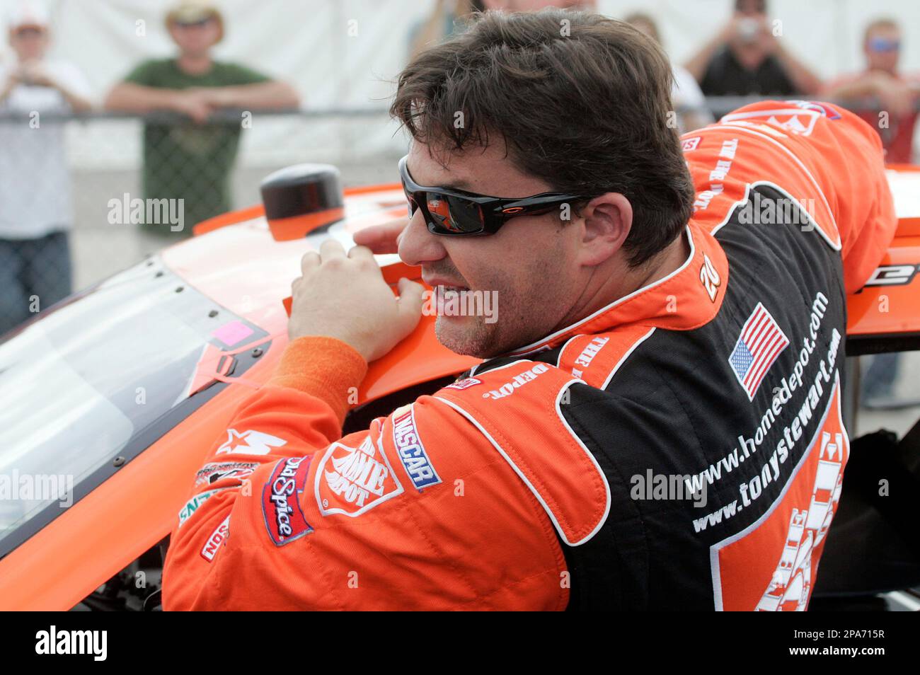 NASCAR driver Tony Stewart climbs out of his race car after qualifying ...