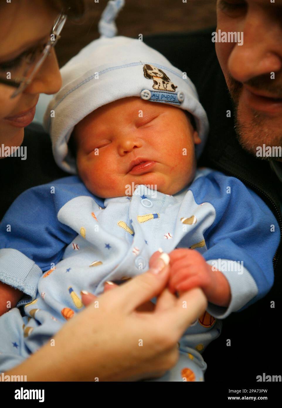 Alaska Governor Sarah Palin, left, and her husband Todd Palin hold ...