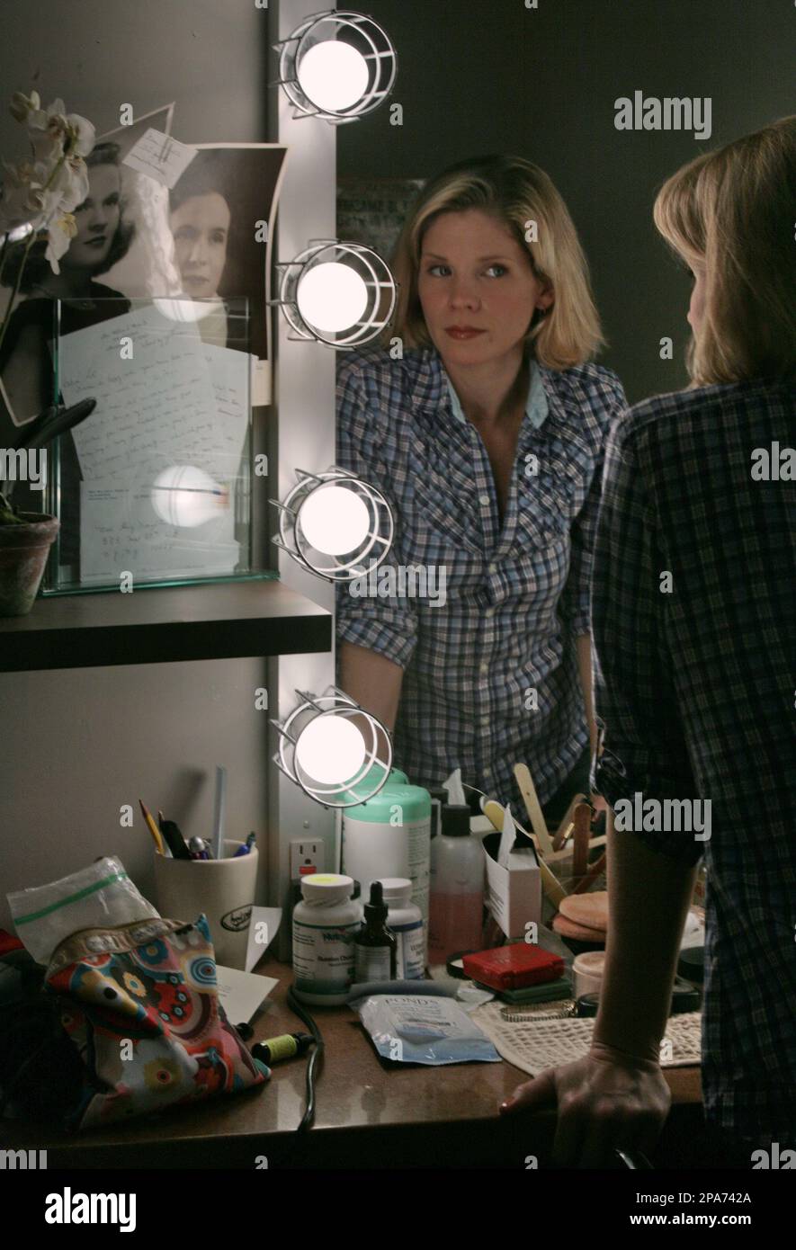 Actress Kelli O"Hara poses in her dressing room next to pictures of her ...