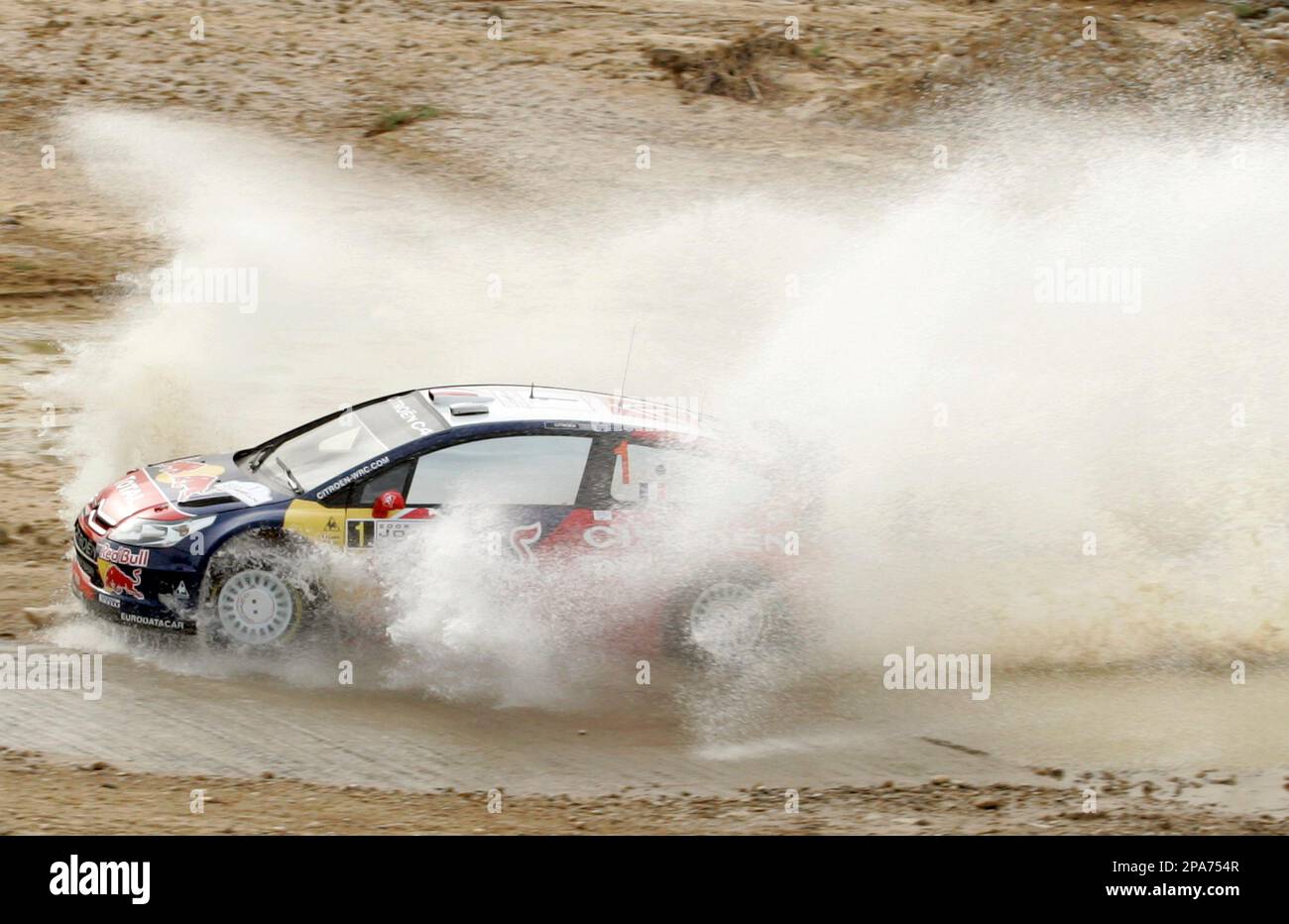 Four-time world champion Sebastien Loeb of France drives his Citroen C4 ...