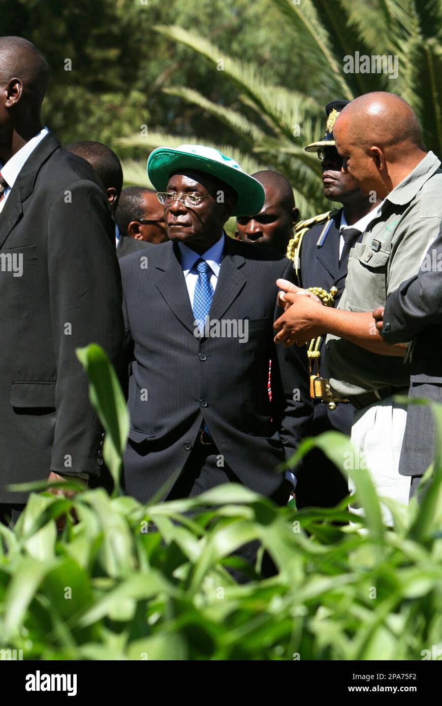 President Robert Mugabe, center, during his tour of the Zimbabwe ...