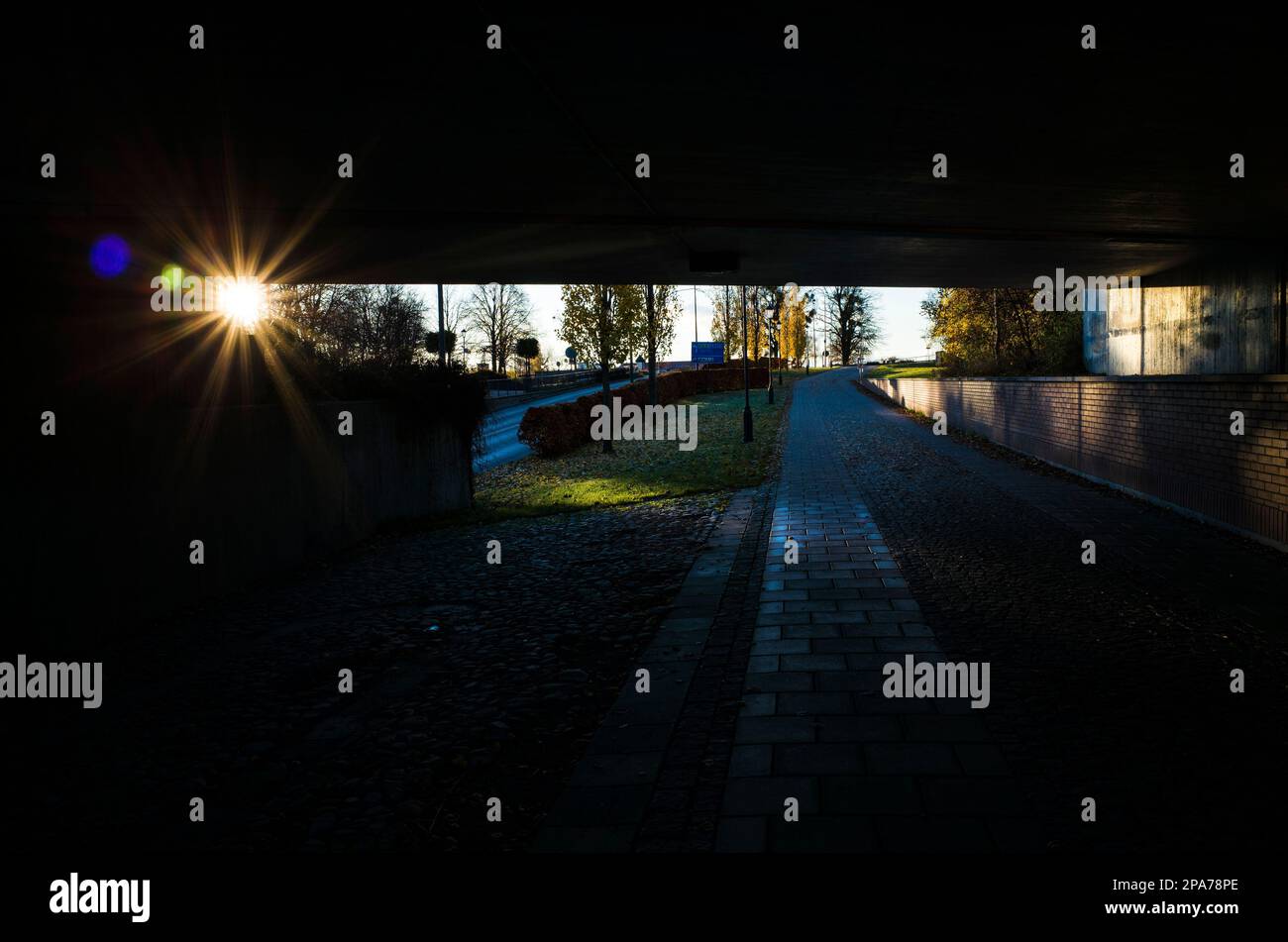 Low autumn sun shines in pedestrian underpass, Urban architecture photo ...