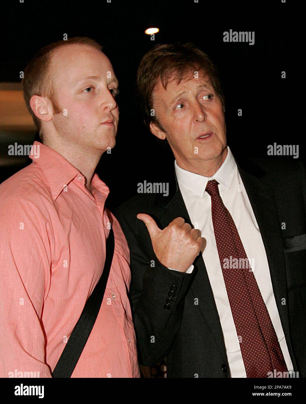 Sir Paul McCartney, right, poses for the photographers with his son ...