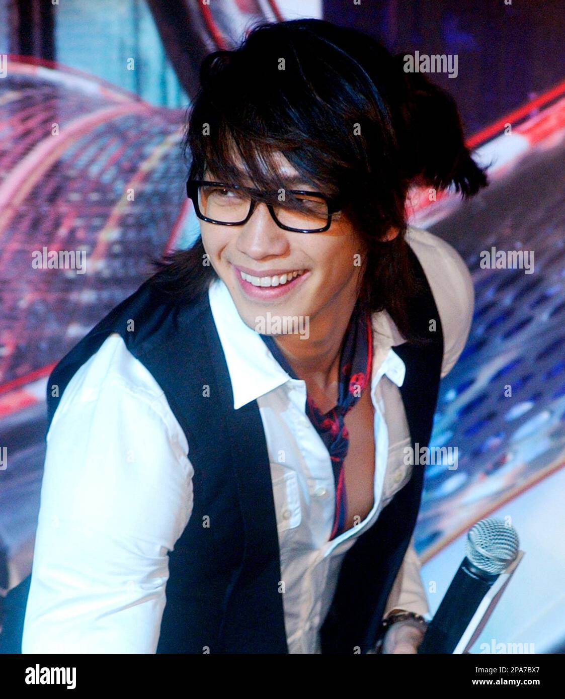 South Korean pop singer Rain smiles while making an appearance to ...