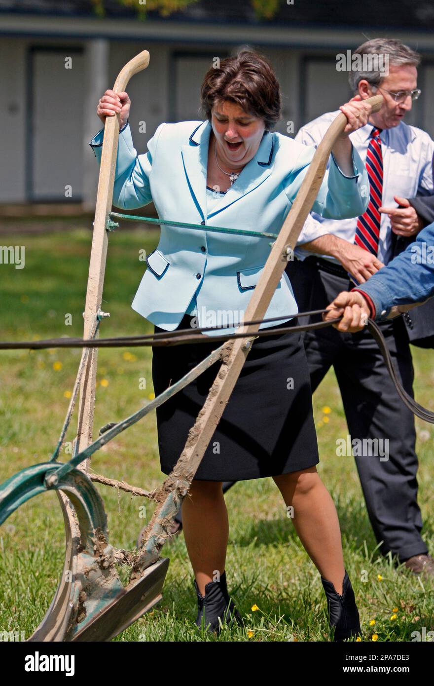 First lady of Virginia Anne Holton holds the mule-drawn plow during the ...