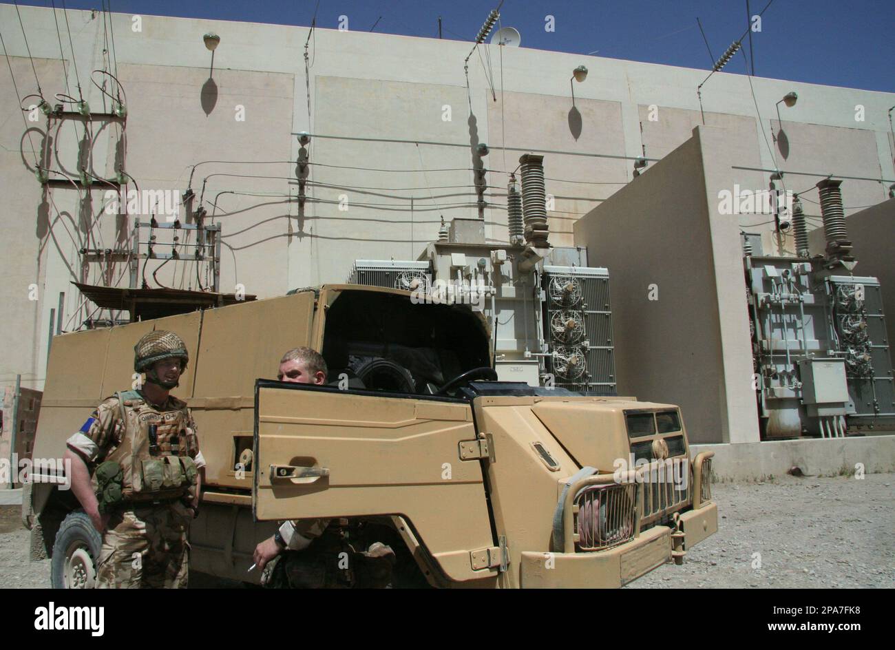 British soldiers with the International Security Assistant Force stands ...