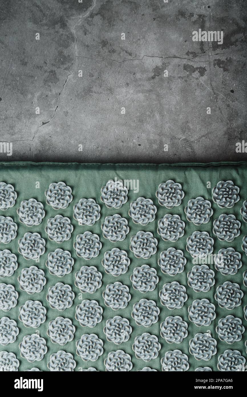 Massage mat with prickly spikes Kuznetsov applicator top view. On a ...