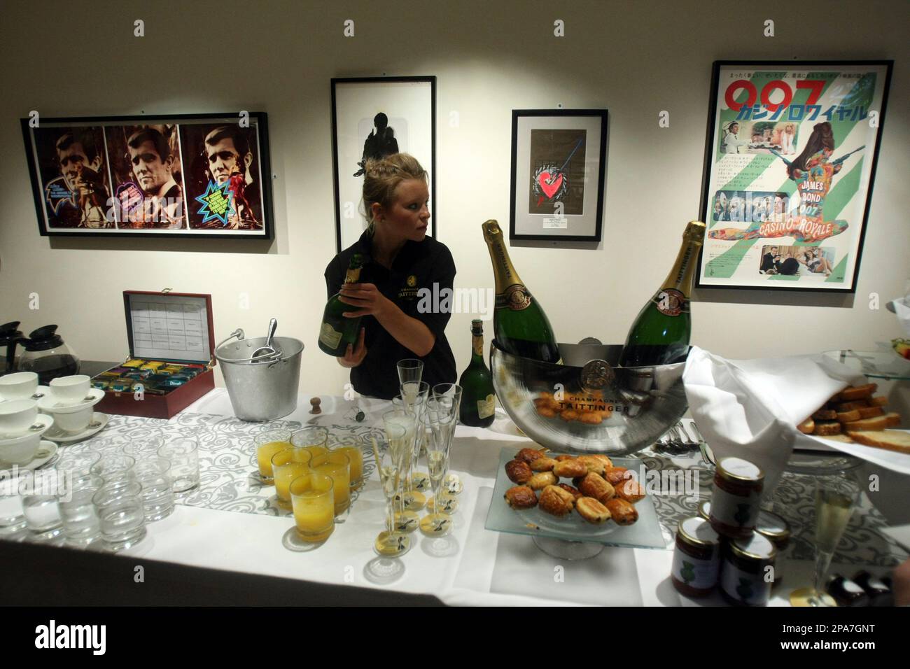 A James Bond themed breakfast buffet is seen in front of various images ...