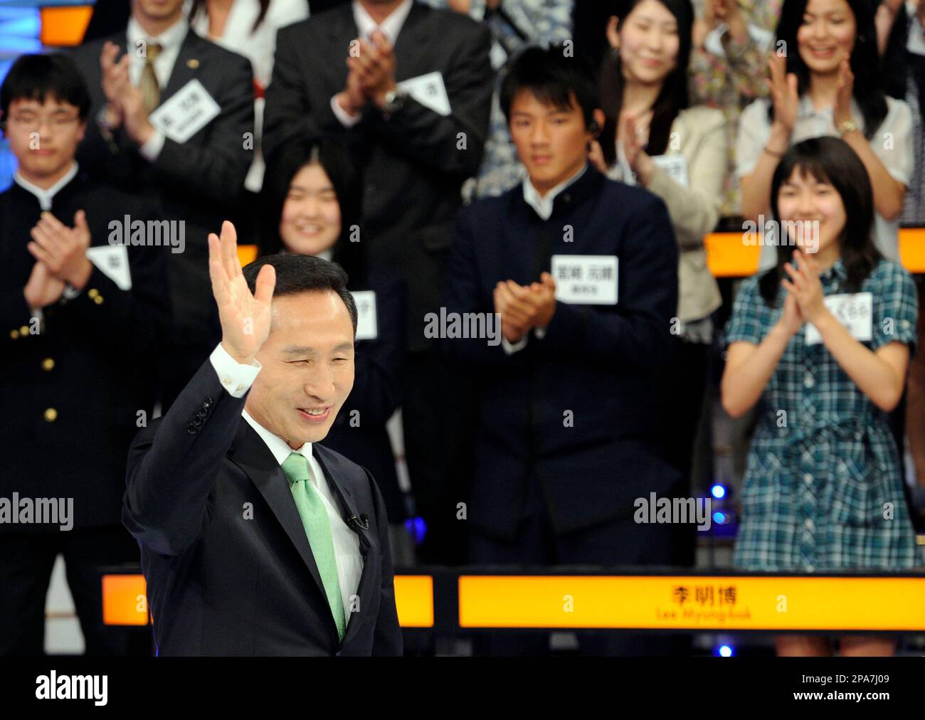 South Korean President Lee Myung-bak is welcomed by audience as he ...