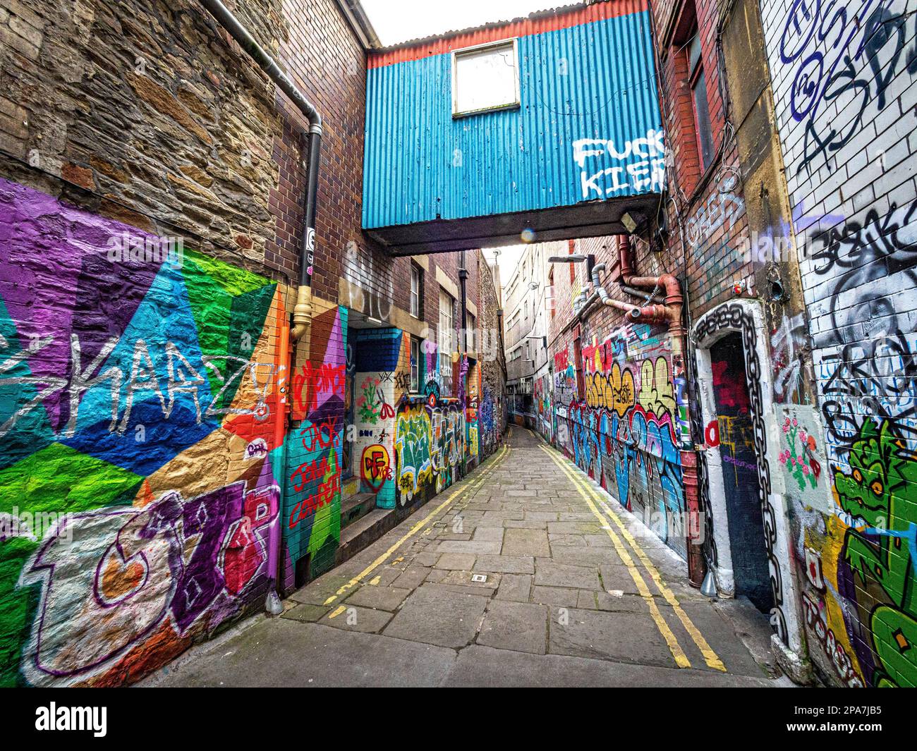 Colourful graffiti covered walls of a narrow alley off Corn Street in ...