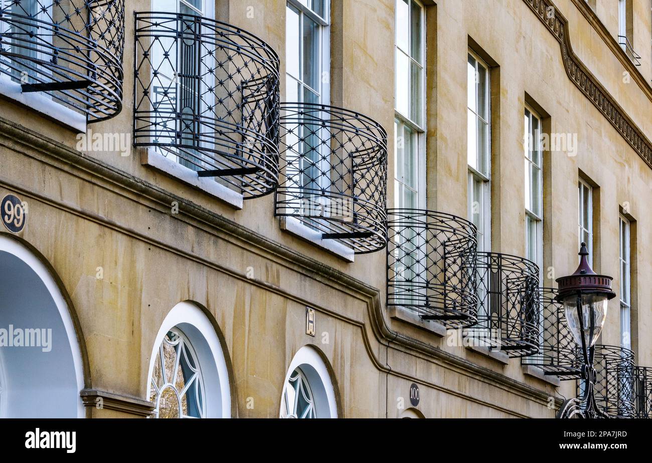 Wrought iron cylindrical basket window balconies on the facade of ...