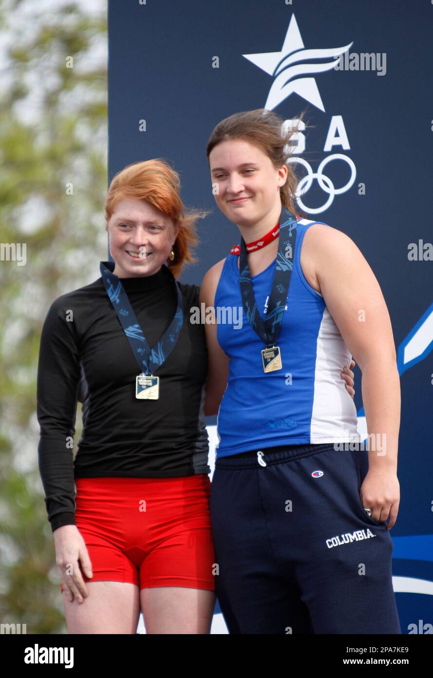 Kaitlyn McEvoy, left, and Hannah Menke, right, stand on the awards ...