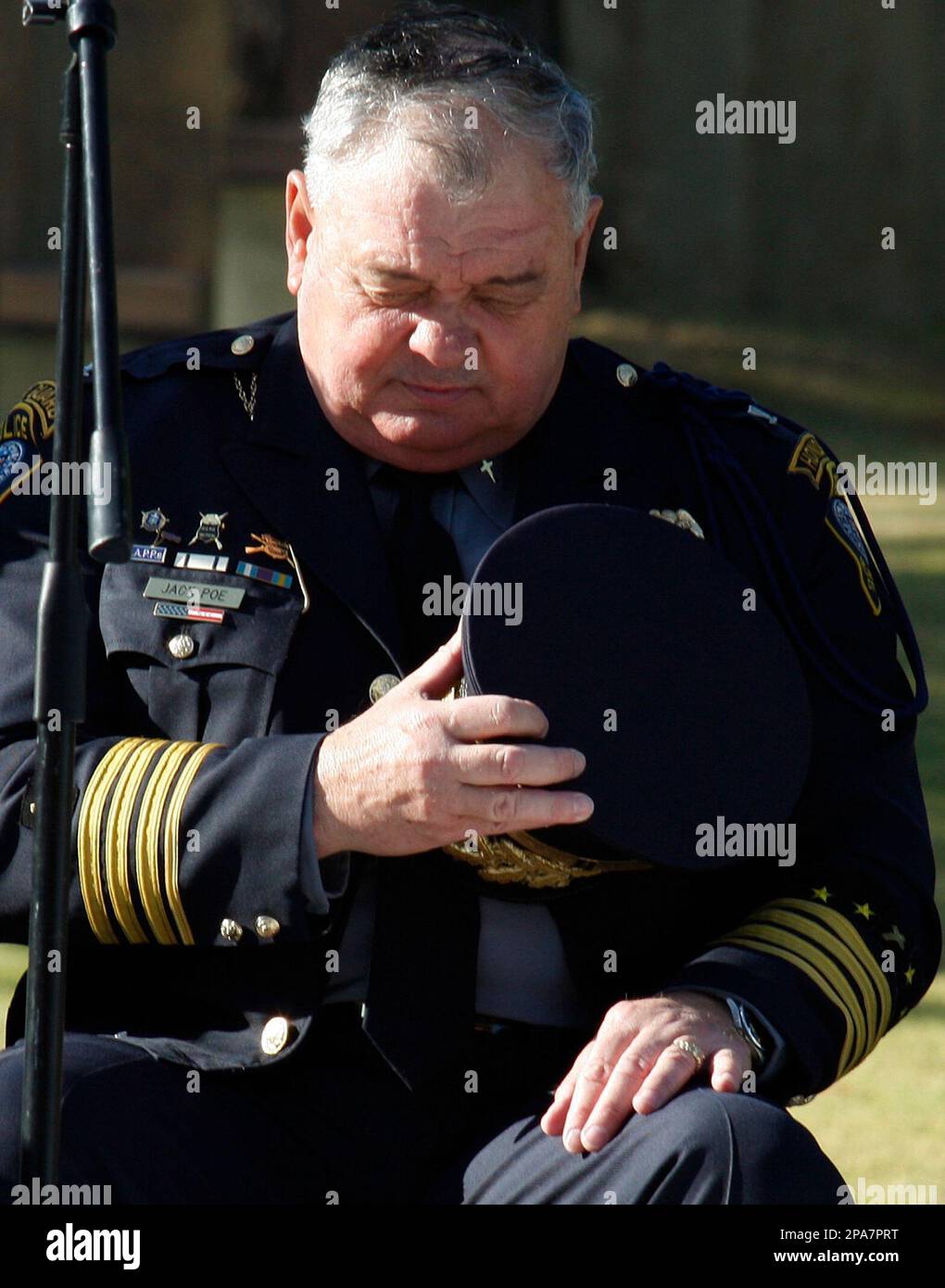 Chaplain Jack Poe, of the Oklahoma City Police Department, bows his ...