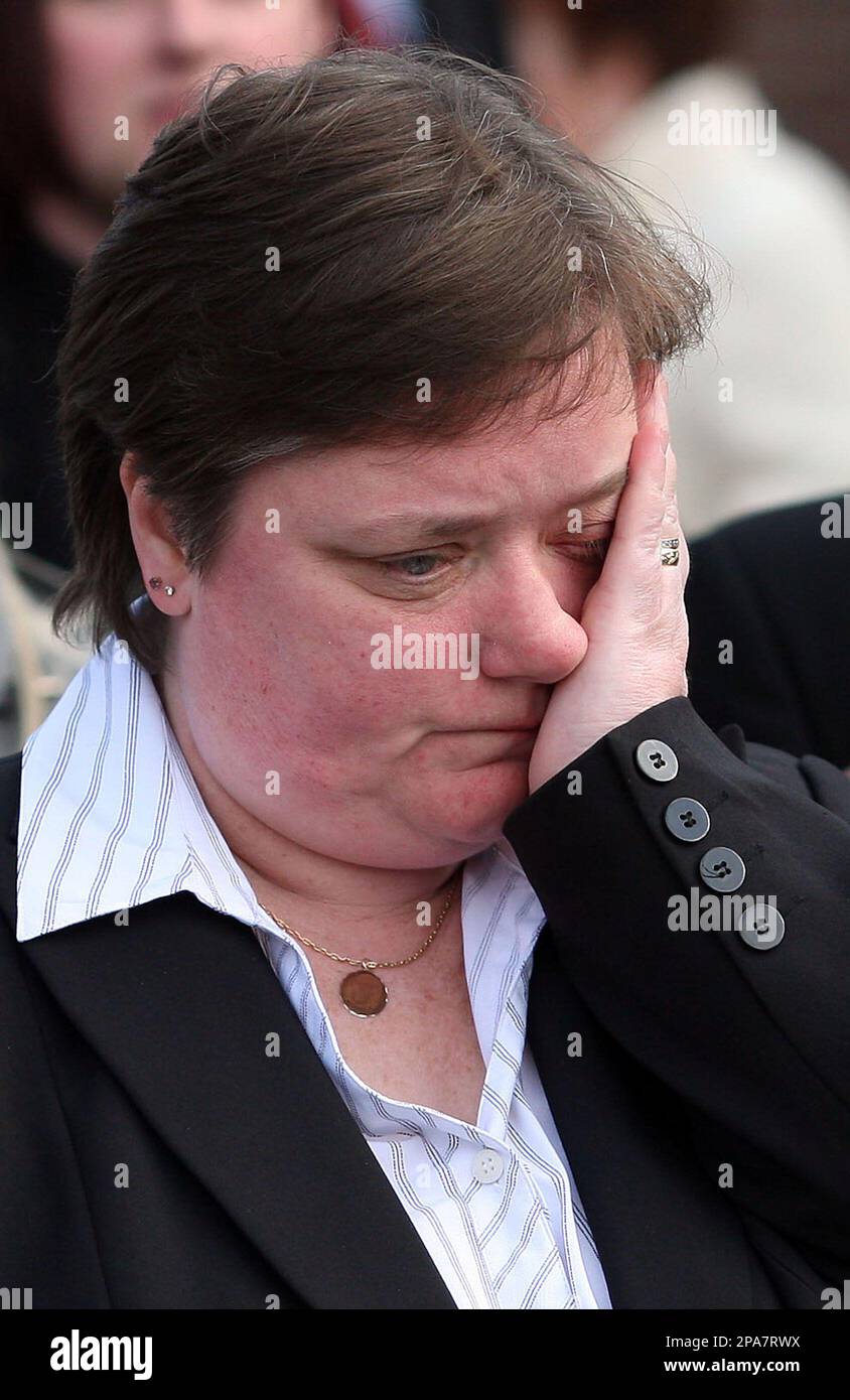 Julie Best wipes away tears during the funeral of her father Dickie ...