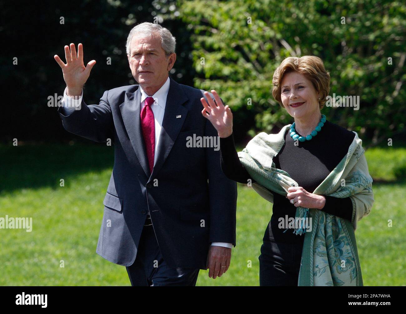 President Bush and first lady Laura Bush walk from the Oval Office of ...