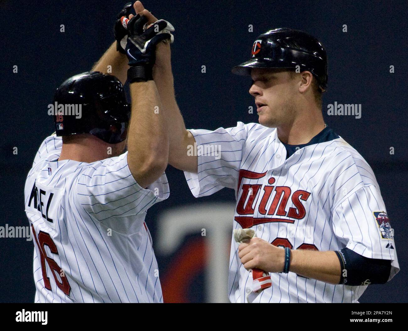 Minnesota Twins' Justin Morneau, right, celebrates with Jason Kubel ...