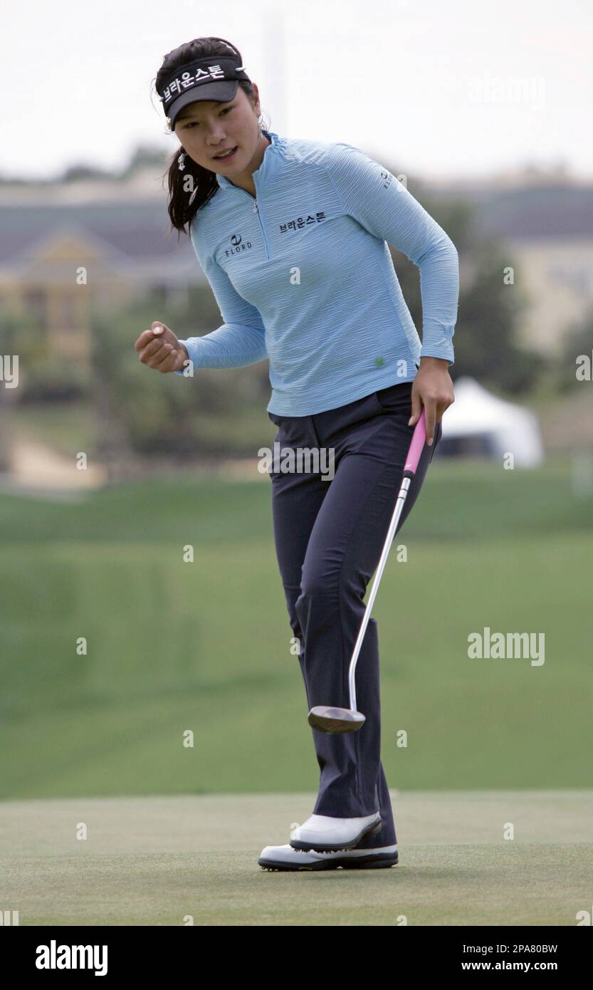 Hee Young Park, of South Korea, pumps her fist after sinking a birdie ...