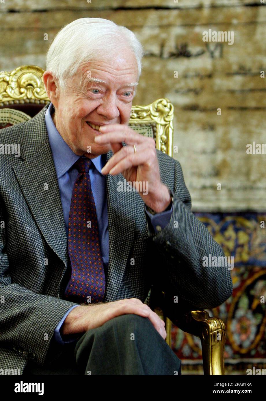 Former U.S. President Carter looks on during his meeting with Egyptian ...