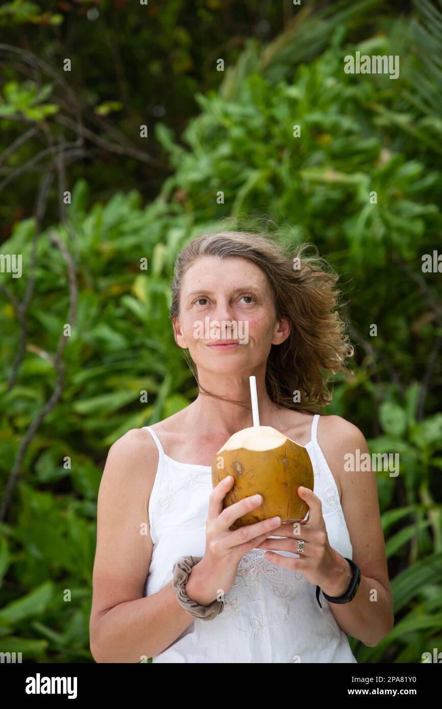 woman portrait and lush tropical greenery Stock Photo - Alamy