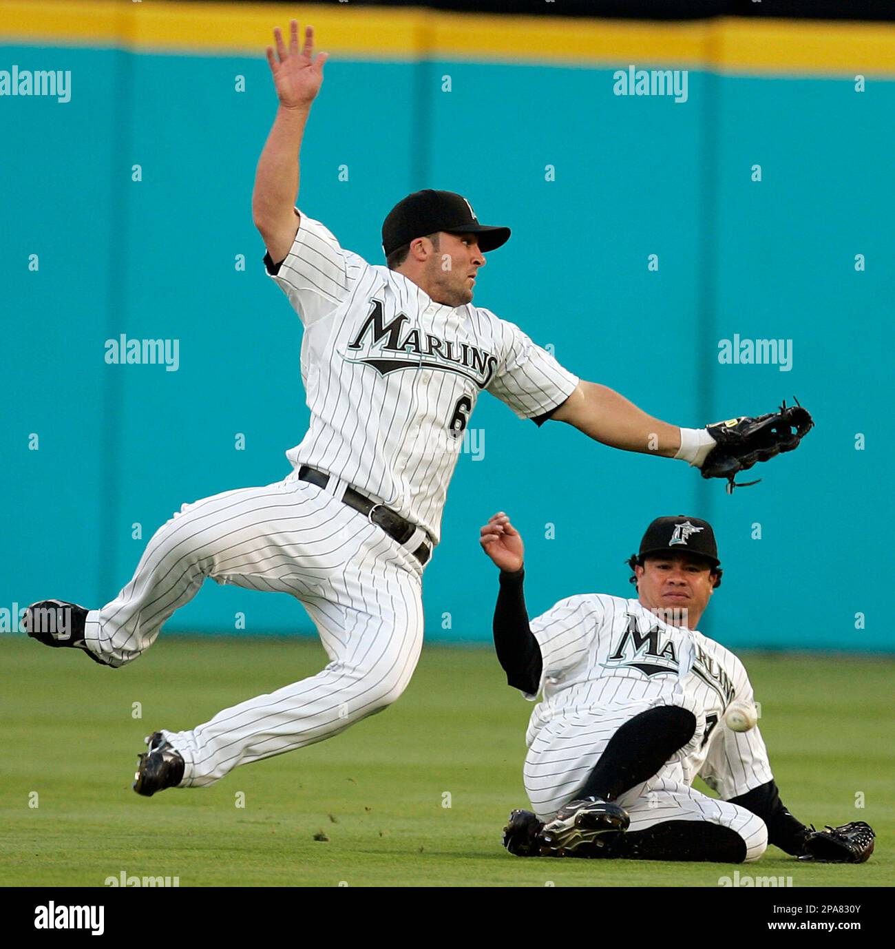 After almost colliding in the out field, Florida Marlins players Dan ...