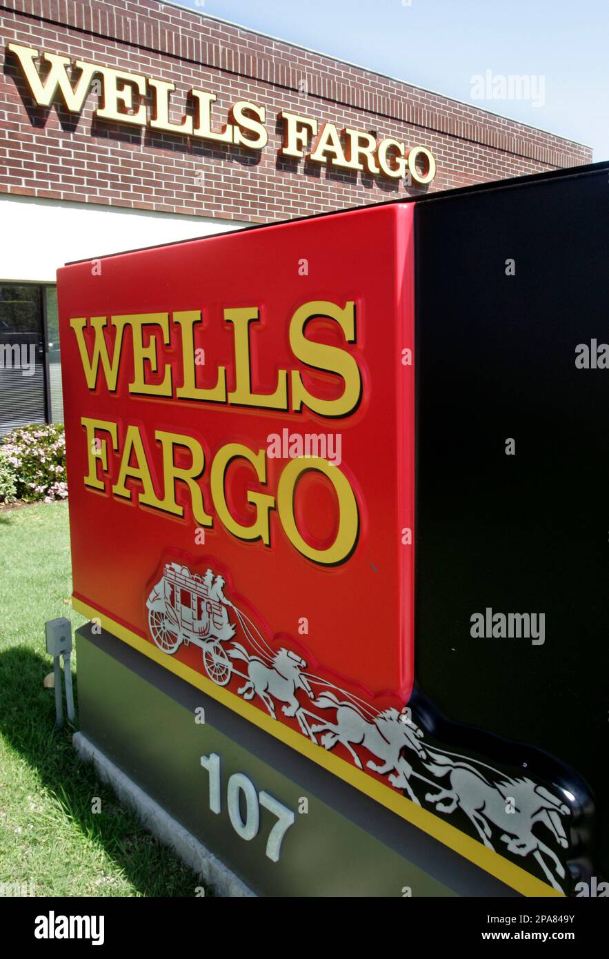 A Wells Fargo Bank sign is seen on display at a Wells Fargo Bank in ...