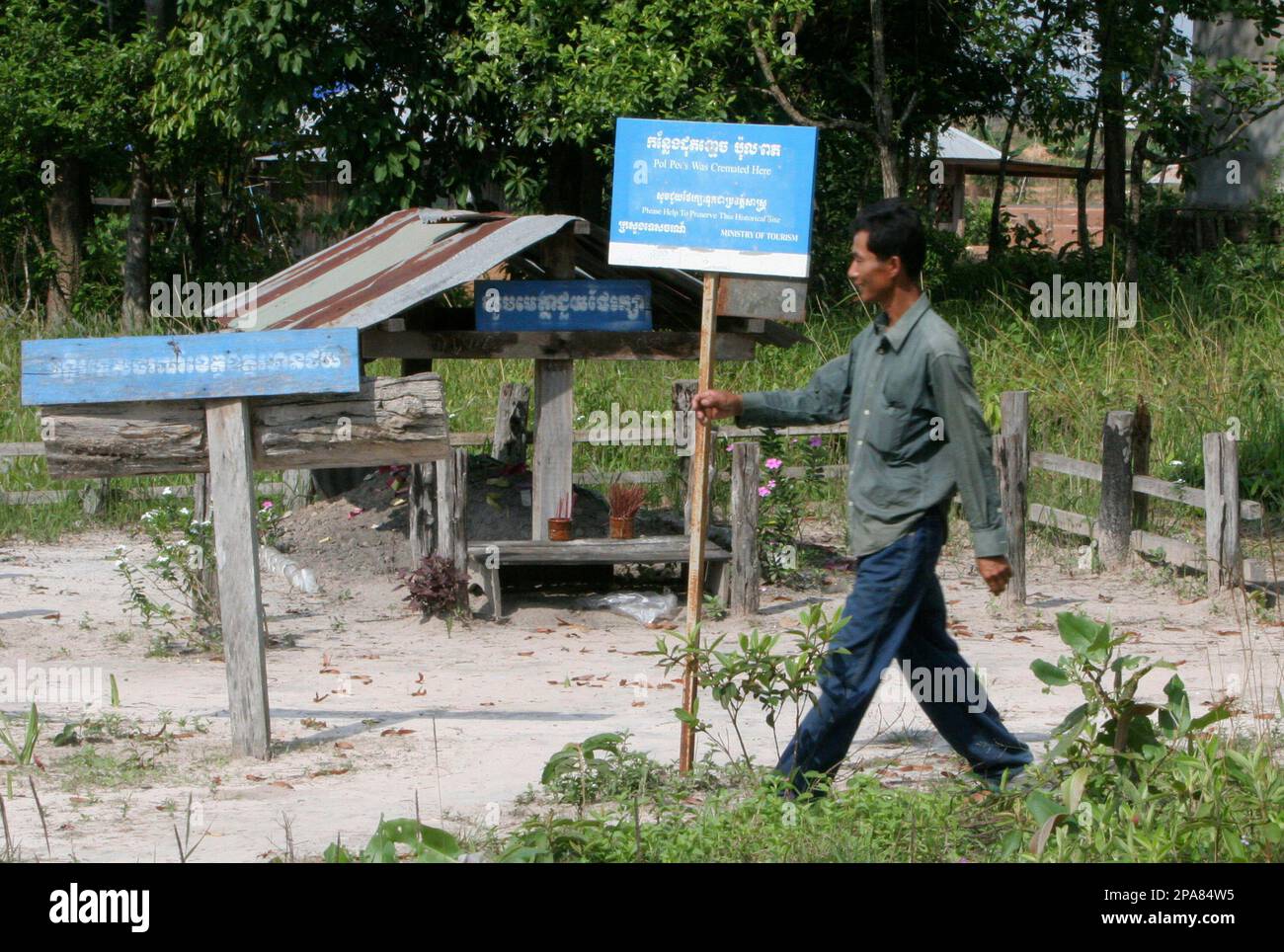 Sieng Kim Chean, a 40-year-old Cambodian villager, walks past the ...