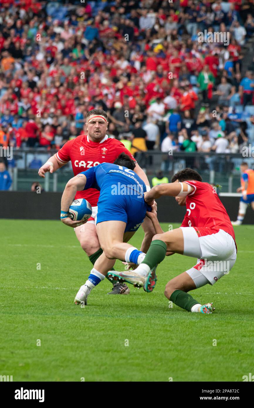 Rome, Italy 11th Mar, 2023. Joe Hawkins of Wales tackle with Tommaso ...