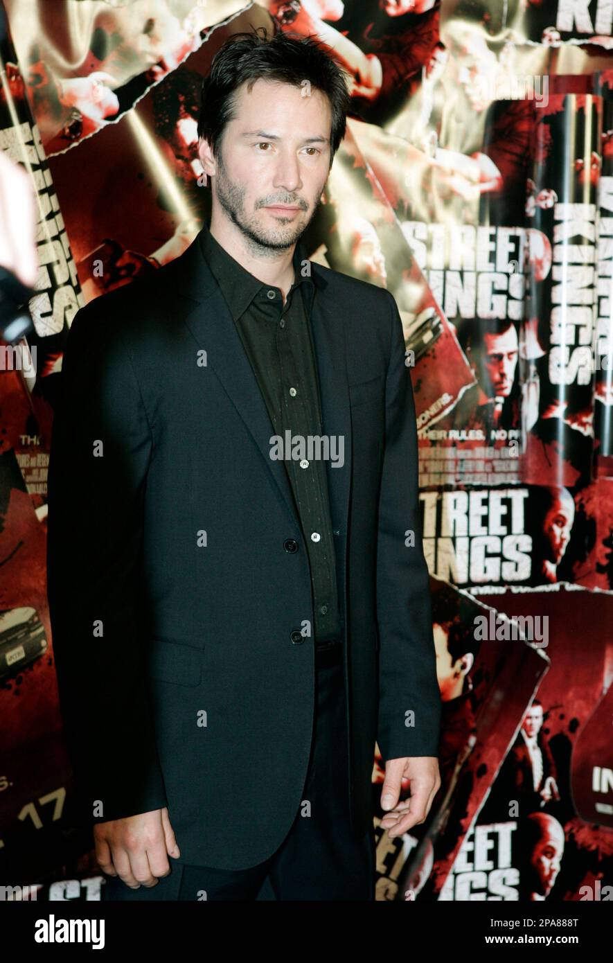 Hollywood actor Keanu Reeves poses for photos as he arrives for the ...