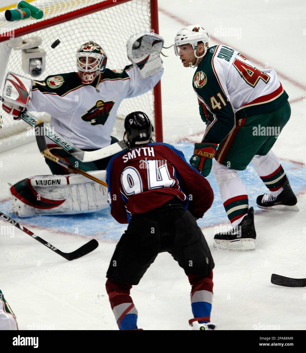 Minnesota Wild goalie Niklas Backstrom, left, of Sweden, deflects a ...