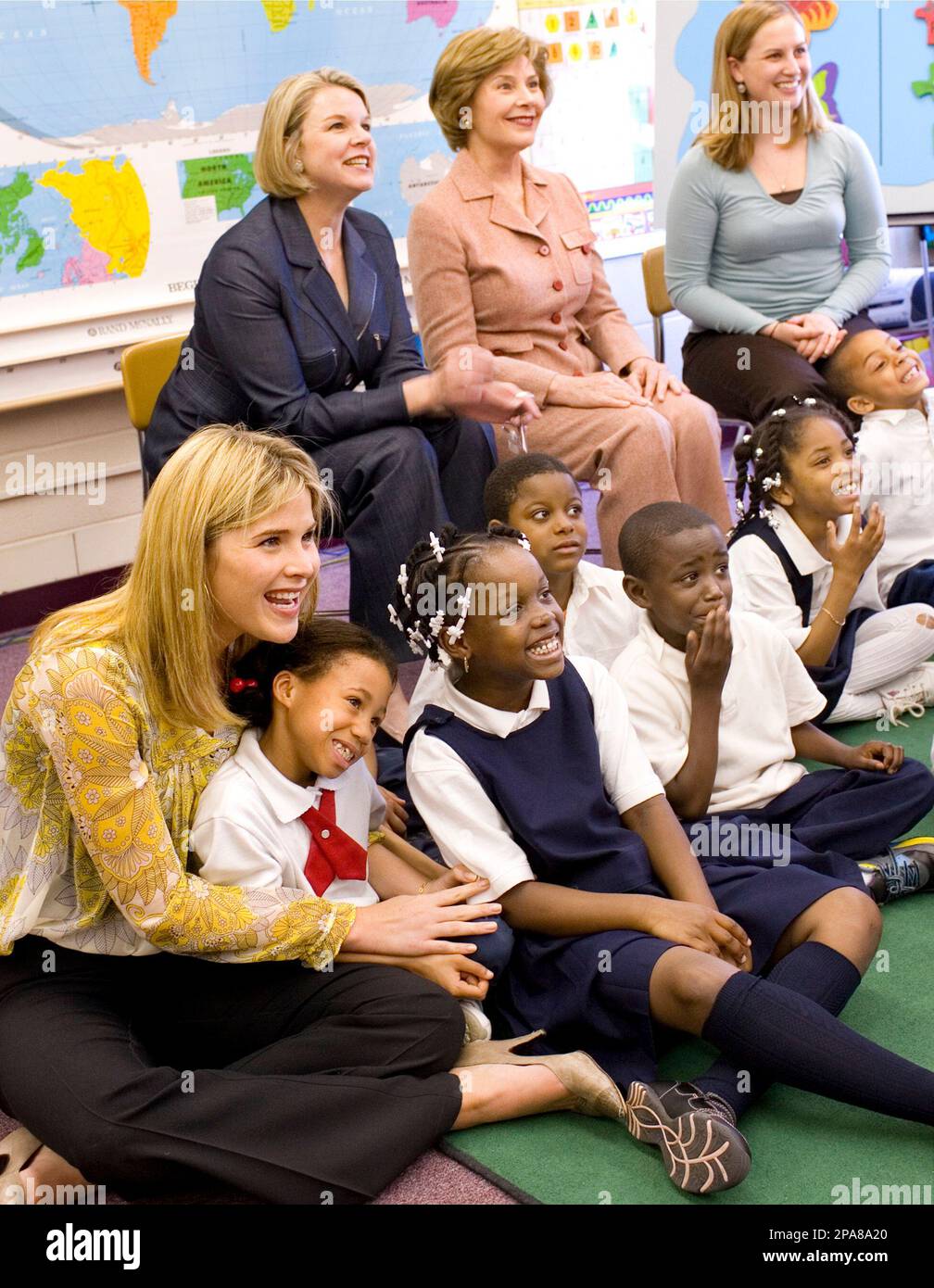 First lady Laura Bush, top center, accompanied by Education Secretary ...