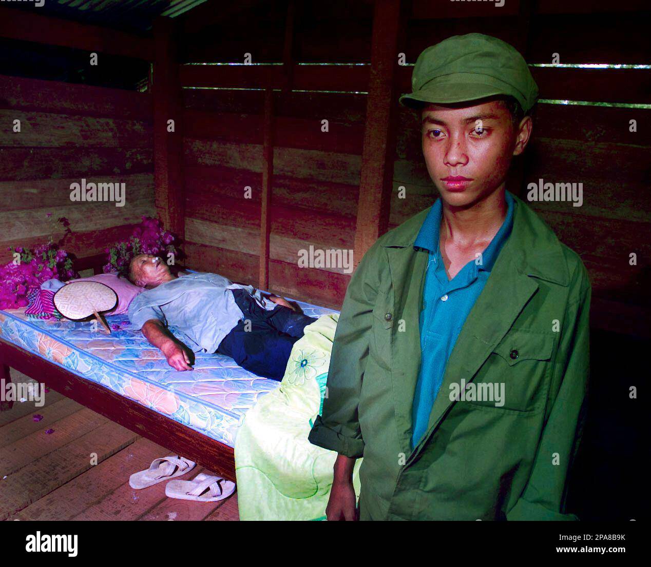 **FILE**A Khmer Rouge soldier stands near the body of leader Pol Pot in ...
