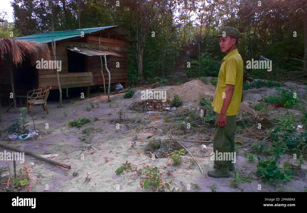 **FILE**A Khmer Rouge soldiers, assigned to guard Pol Pot, looks on ...