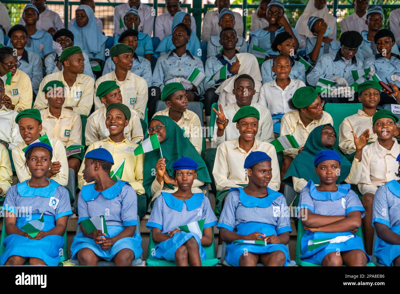 School children waves the Nigerian flag during Nigeria’s 62nd ...